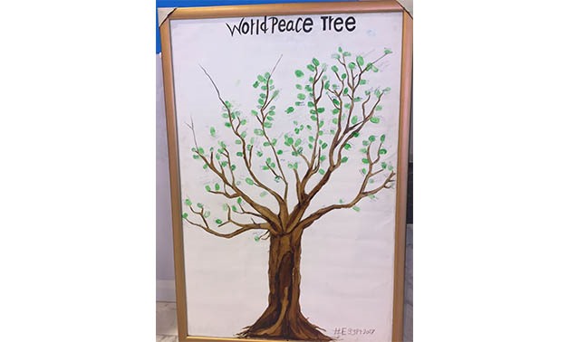 WYF participants sign world peace tree - EgyptToday